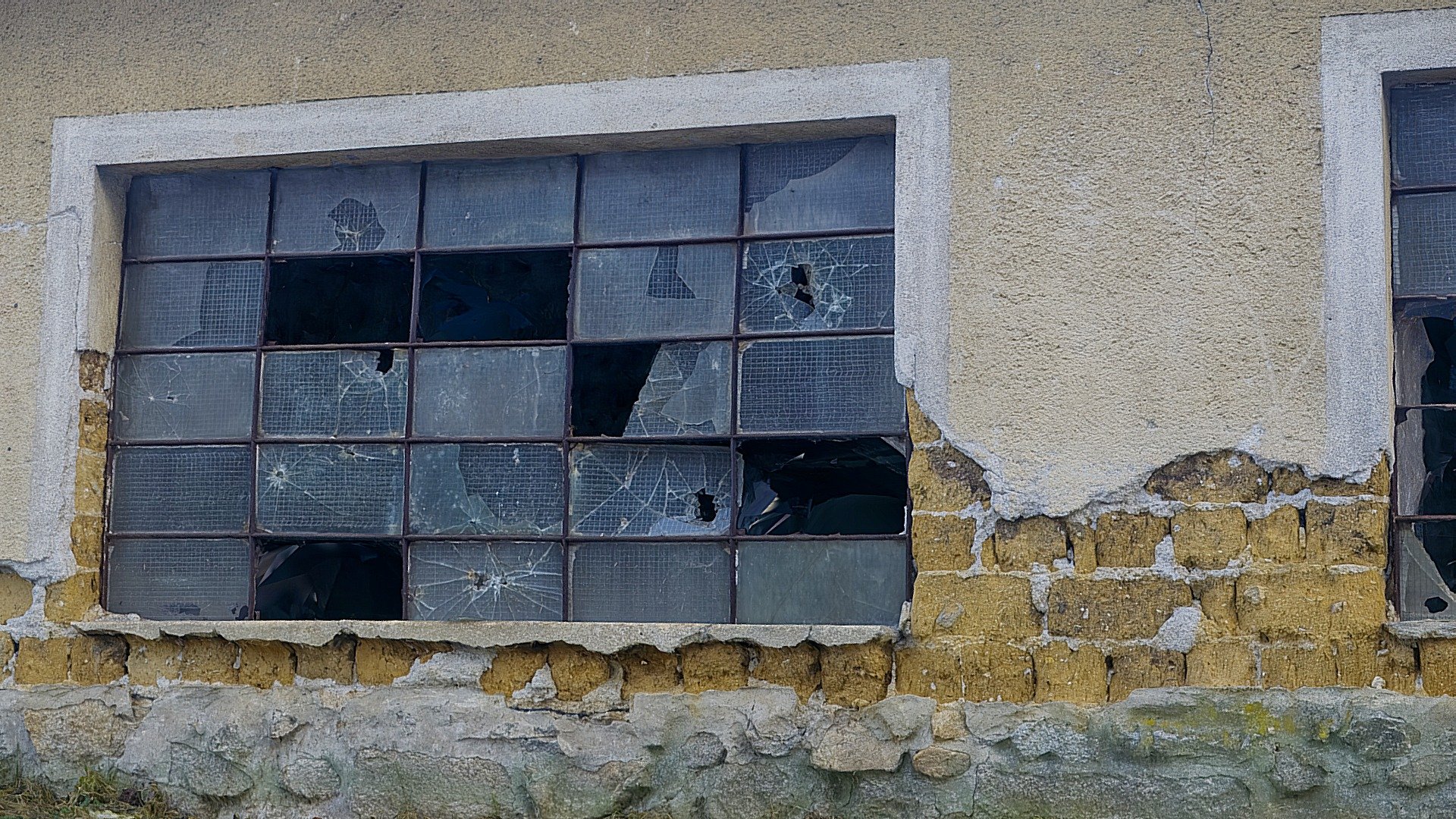 Old damaged plaster wall with broken windows | Fab